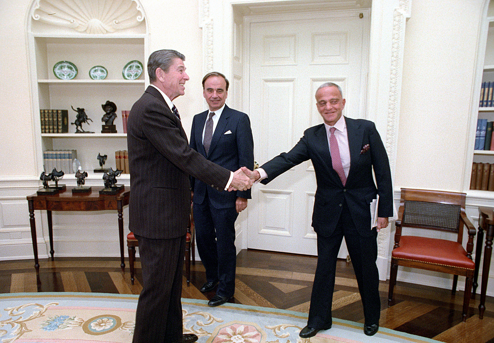President Reagan shakes hands with Roy Cohn in the Oval Office (Jan. 18 ...